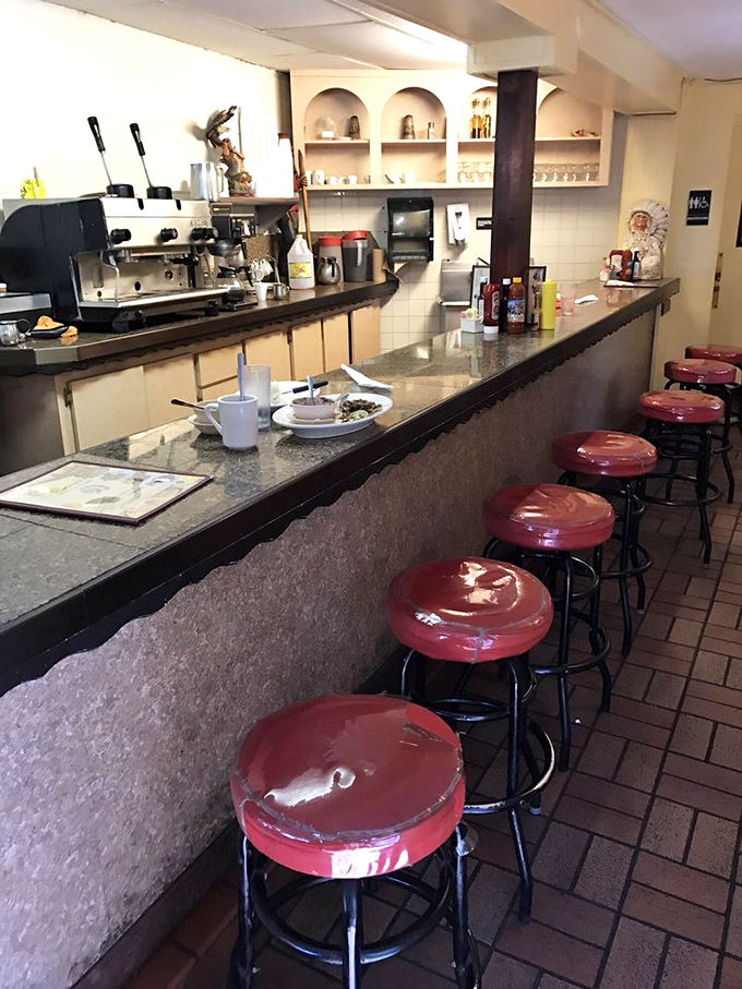 The counter seating offers front-row tickets to the culinary show, where sandwich magic happens just feet from your hungry eyes.