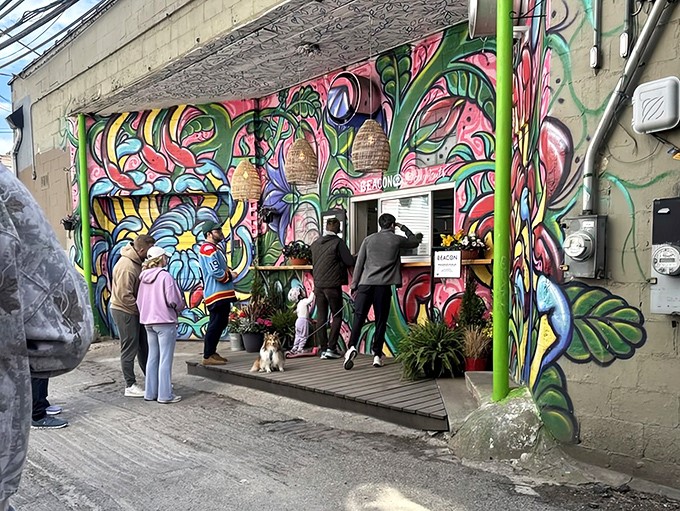 The pilgrimage to pastry perfection &ndash; donut devotees gathering at the colorful shrine of breakfast indulgence.