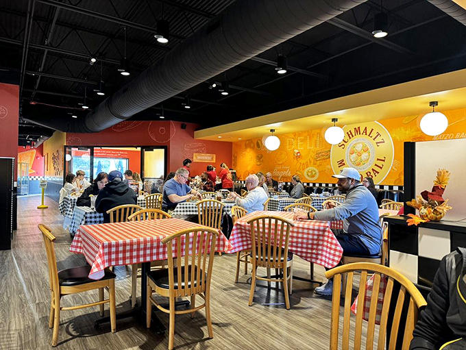 Happy diners enjoying the fruits of Schmaltz's labor &ndash; proof that good food brings people together better than any social media app.