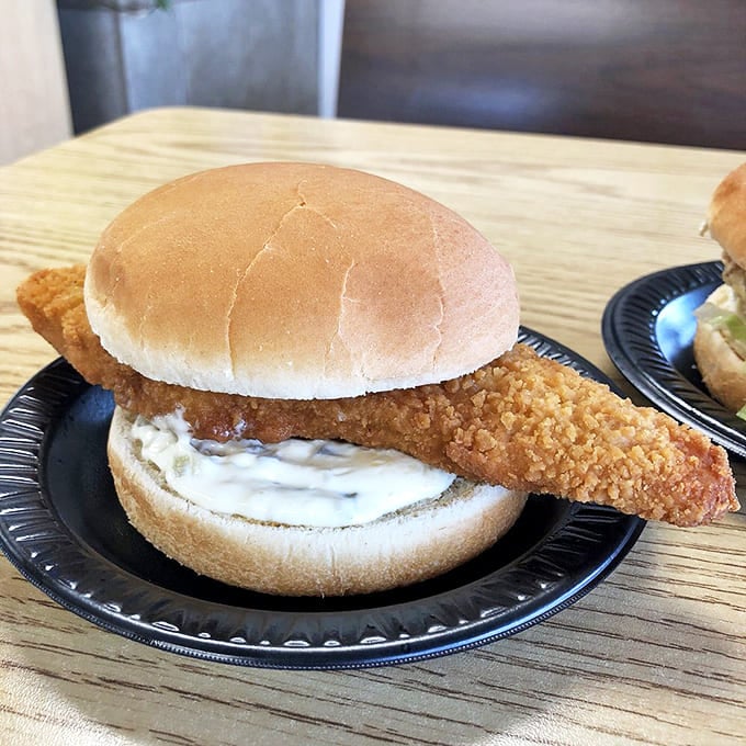 The unsung hero of the menu &ndash; crispy fish spilling gloriously beyond its bun boundaries, ready to challenge the chicken's supremacy.