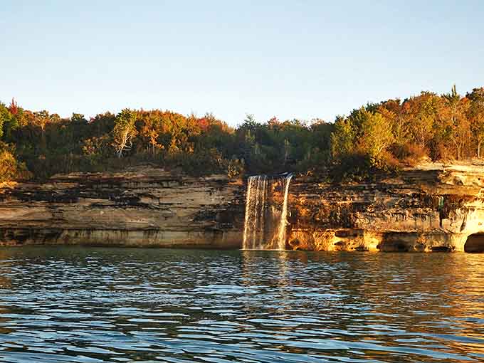 When the setting sun hits just right, Spray Falls becomes a golden ribbon connecting earth and water in perfect harmony.