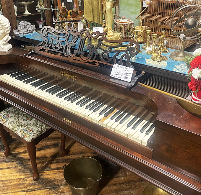 The grand piano waits silently for phantom fingers to bring ragtime melodies back to life in this musical corner.