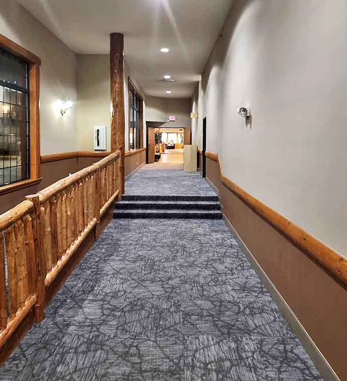 Thoughtful design extends to every corner, with hallways that continue the northwoods aesthetic without sacrificing modern comfort.