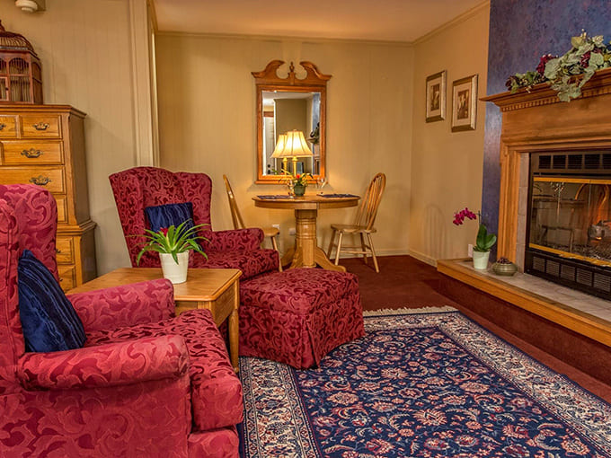 Rich crimson chairs invite intimate conversations beside a crackling fireplace &ndash; the Goldmoor's version of "Netflix and chill" for grown-ups.