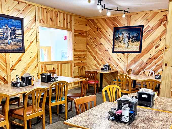 Wooden chevron patterns and warm lighting create the perfect backdrop for morning conversations and coffee refills that arrive before you ask.