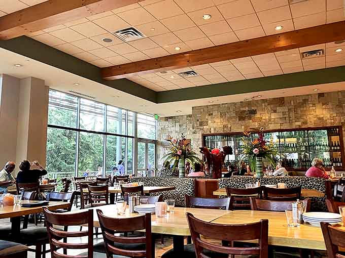 Natural light floods the spacious interior, highlighting stone accents and warm wood tones that create an inviting ambiance.