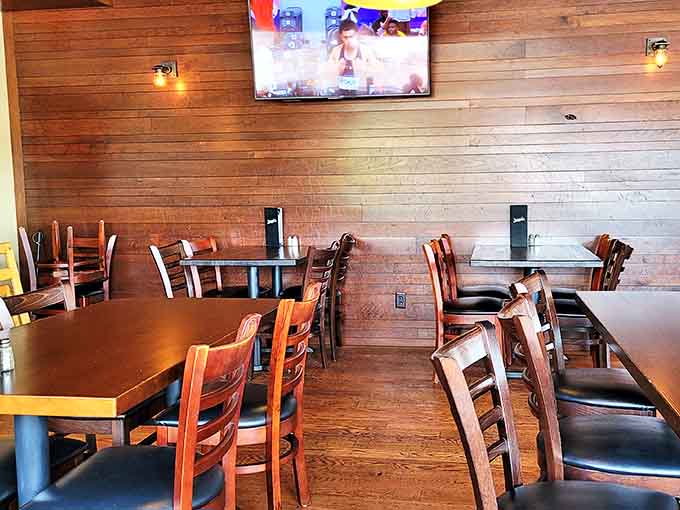 Wooden accents, comfortable seating, and just-right lighting create the perfect backdrop for lingering conversations and "just one more bite" moments.