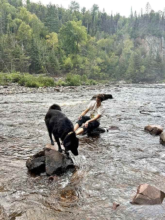Dogs and their humans find common ground in the simple joy of cool river waters on a warm Minnesota day.