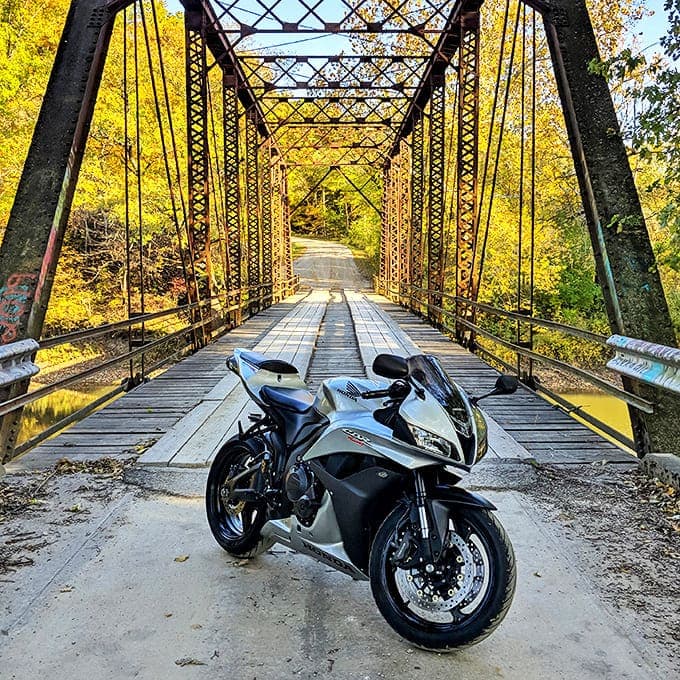 Even modern machines look somehow timeless against the backdrop of Airtight Bridge's historic iron framework.