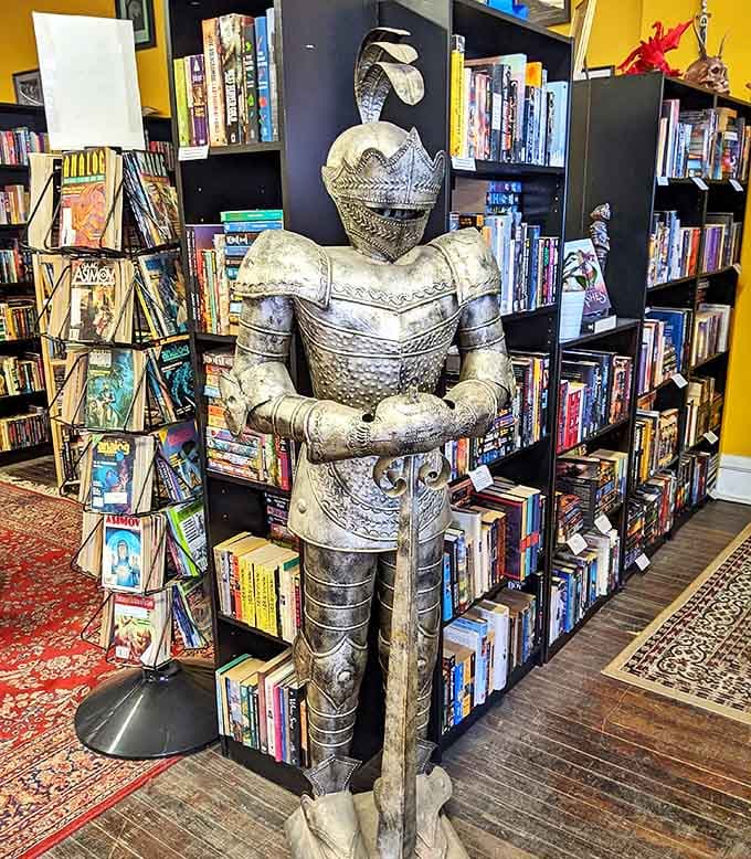 This silent knight guards the fantasy section, judging your literary choices with the stoic dignity of metal nobility.