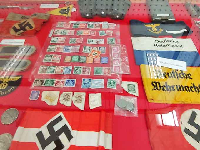 These colorful pennants and flags represent more than military units, they symbolize the pride and identity of soldiers who served under them.