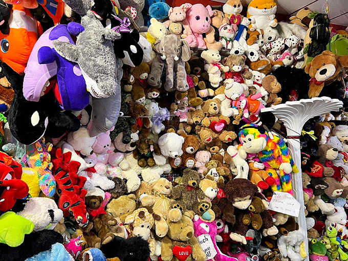 The stuffed animal collection reaches critical mass, creating a plush avalanche that would make any toy store envious of this sugar-coated menagerie.