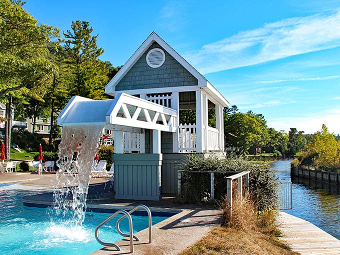 Architectural whimsy meets practical poolside fun with this charming water feature that delights swimmers of all ages.
