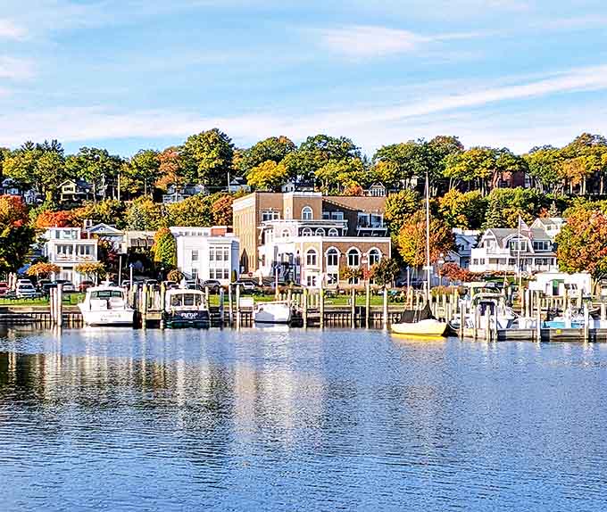 Harbor Springs' waterfront homes stand like elegant sentinels overlooking the bay, their docks extending like welcome mats for returning sailors.