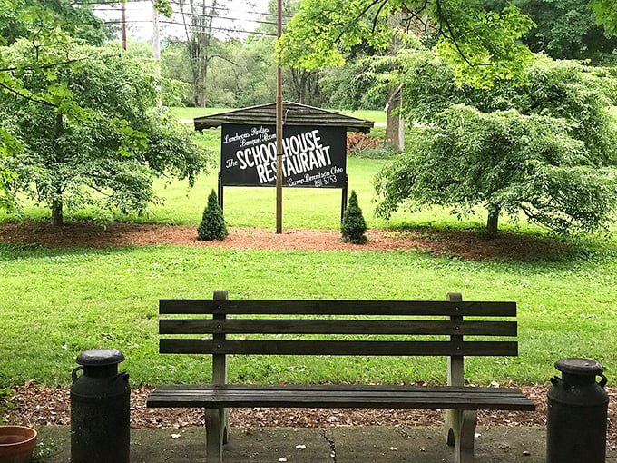 A peaceful bench invites moments of reflection before or after your meal at this historic schoolhouse turned restaurant.
