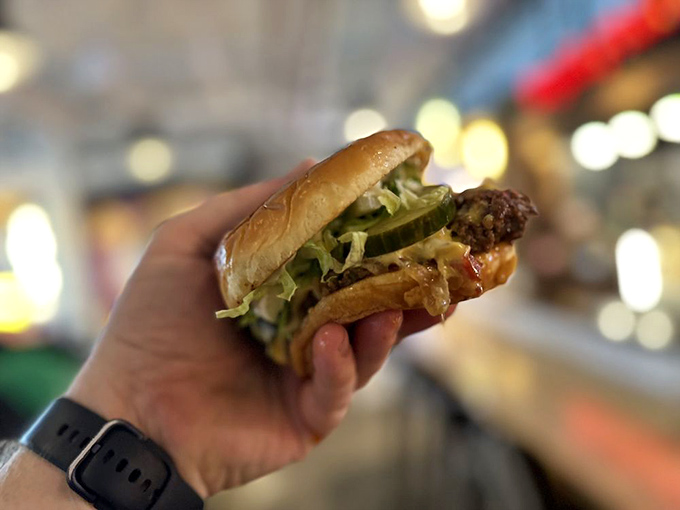 This isn't just any burger &ndash; it's a handheld masterpiece of juicy beef, fresh toppings, and perfectly toasted bun that demands to be devoured.