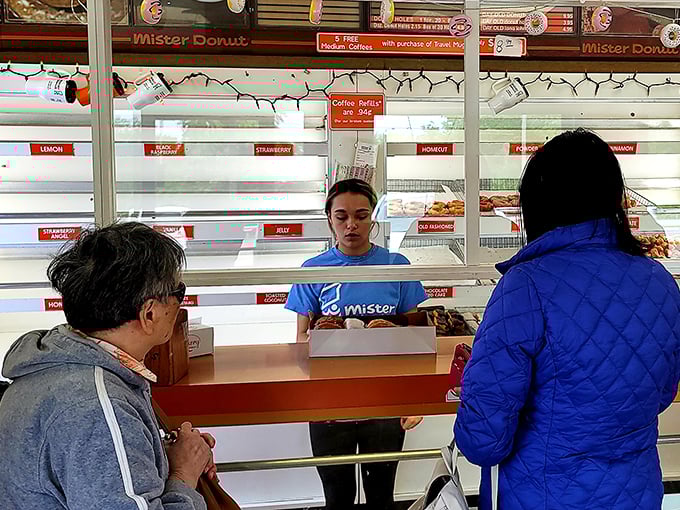The ordering counter – where donut dreams come true through the hands of staff who've perfected their craft through years of dedicated service.