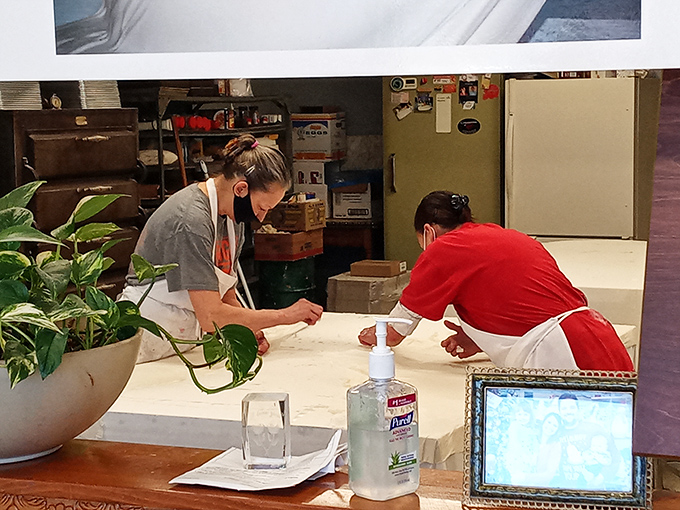 In the kitchen, skilled hands work with practiced precision, transforming simple ingredients into edible magic through time-honored techniques.