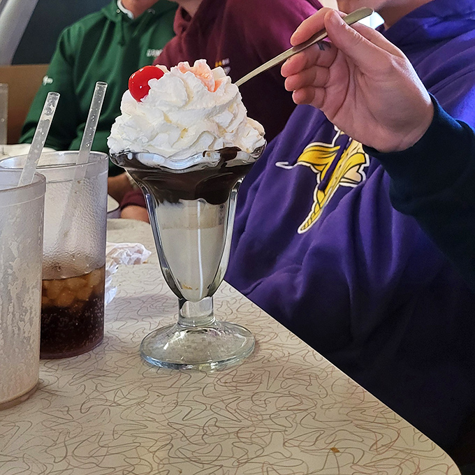 A hot fudge sundae that doesn't need Instagram filters &ndash; just pure, unadulterated ice cream bliss topped with a cherry.