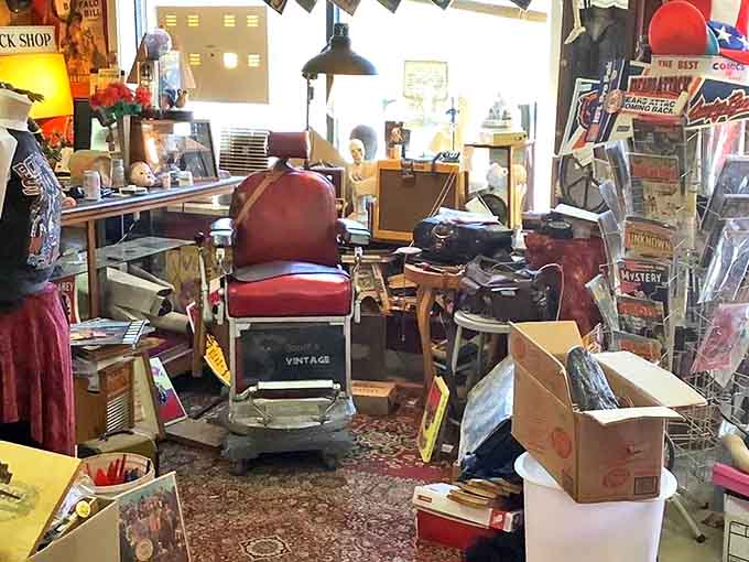 The vintage barber chair where countless men received haircuts, hot shaves, and probably unsolicited life advice.