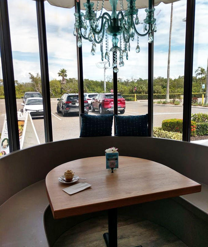 A chandelier hanging above a window seat transforms an ordinary coffee break into a mini-vacation &ndash; luxury in small, affordable doses.