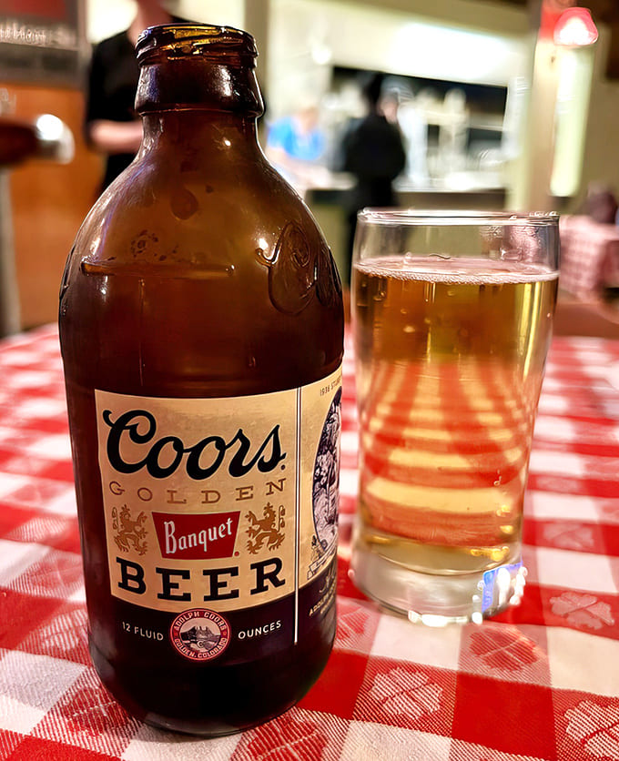 A cold Coors Banquet on a red checkered tablecloth &ndash; sometimes the simplest pleasures are the most satisfying.