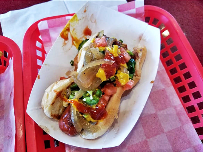 Hot Dog: Not your average ballpark frank &ndash; loaded with colorful toppings that transform a simple pleasure into a knife-and-fork affair.