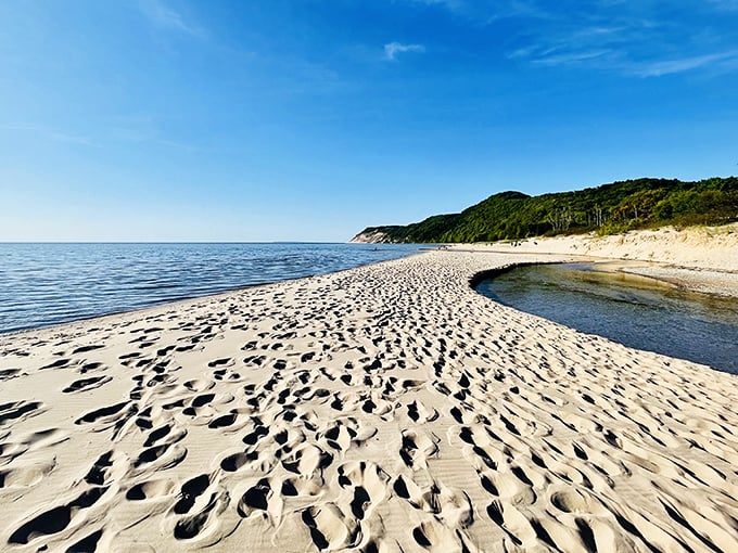 The pristine sands of Esch Road Beach create a peaceful retreat where Otter Creek meets the vast blue waters of Lake Michigan.