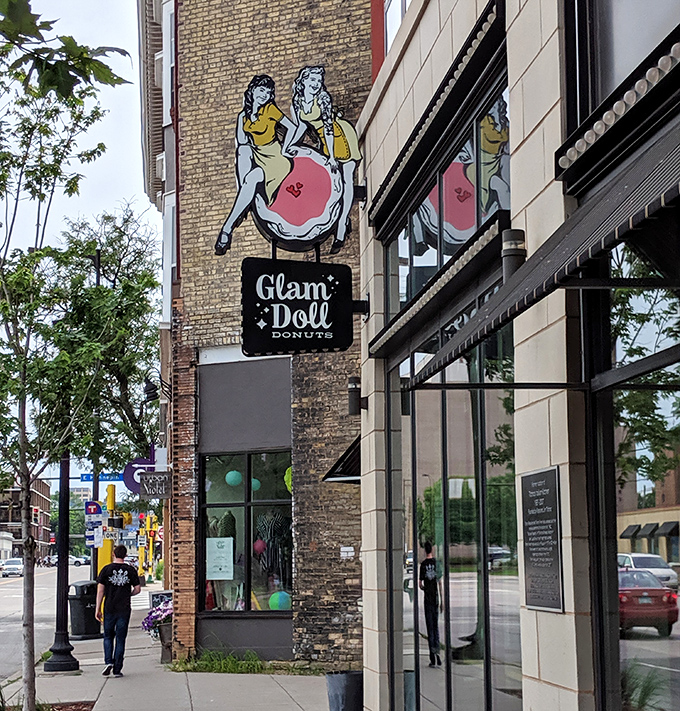 The vintage-inspired sign featuring a pin-up girl riding a donut perfectly captures this shop's playful, creative approach to pastry.