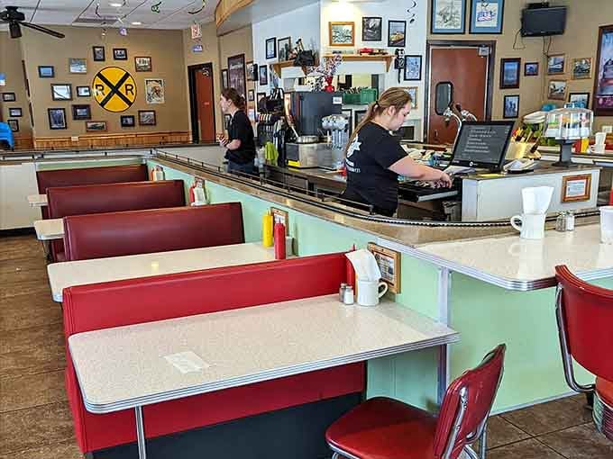 Red vinyl booths and classic diner aesthetics create the perfect backdrop for the star attraction – trains delivering delicious meals.