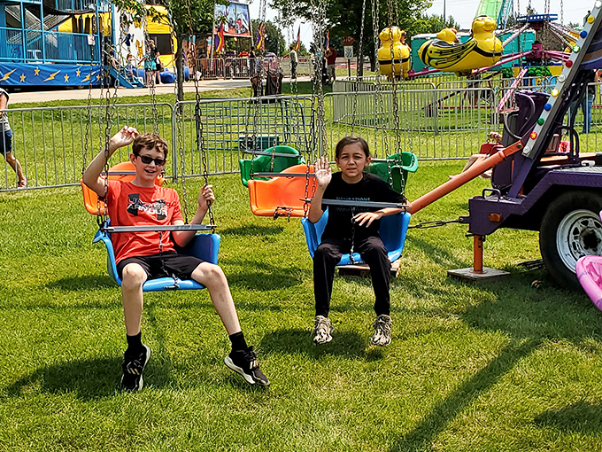 The 4th of July carnival brings those perfect childhood moments—equal parts excitement and innocence. These memories glow brighter in retrospect.