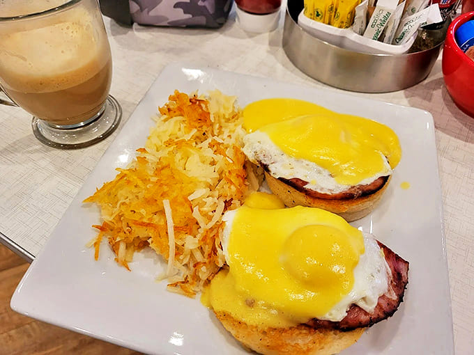 Eggs Benedict that would make a brunch enthusiast weep – golden hollandaise cascading over perfectly poached eggs and Canadian bacon.