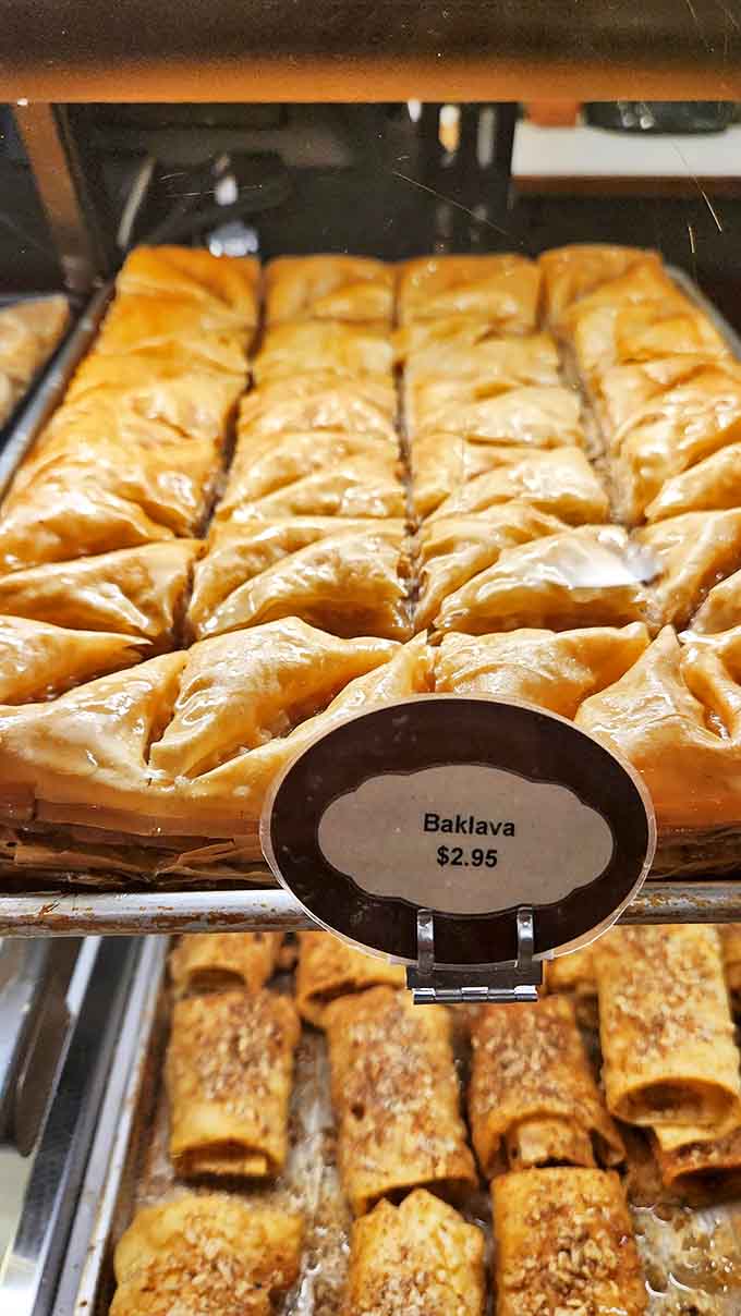 Baklava that glistens with honey, its layers of phyllo as thin as whispered secrets, hiding a treasure of nuts and spices within.