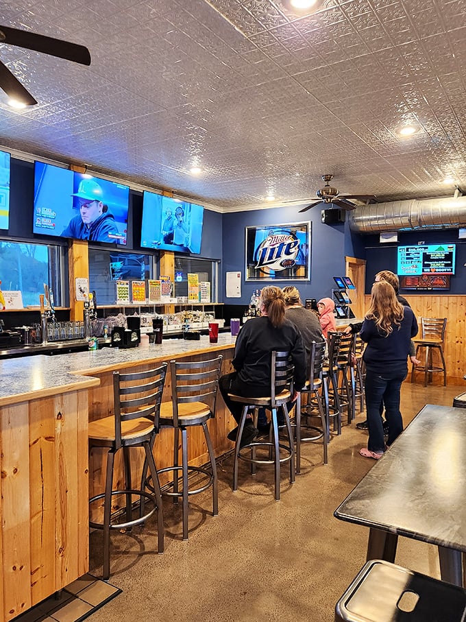 The bar area buzzes with conversation and laughter, where strangers become friends over shared chicken appreciation.