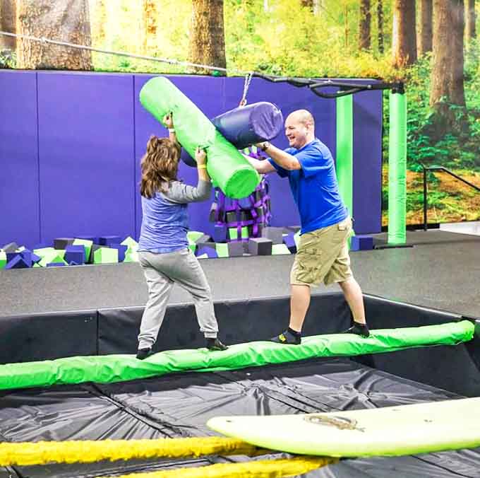 The battle beam: medieval jousting meets pool noodles. Two enter, one stays dry&mdash;a modern interpretation of Gladiator for the suburban warrior.