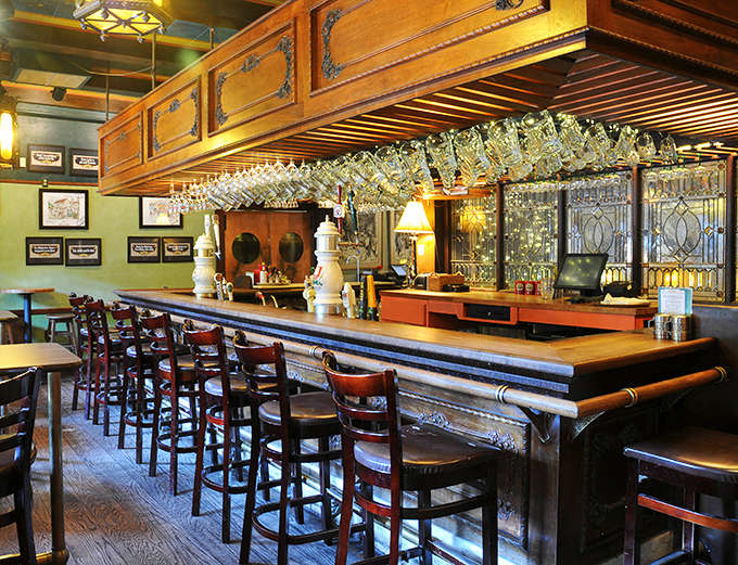 The bar showcases an impressive collection of glassware hanging overhead &ndash; each stein waiting for its perfect pour of German beer.