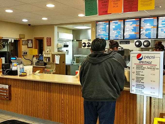 The moment of truth approaches as customers place their orders, each one step closer to Happy's legendary comfort food paradise.