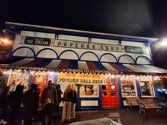 The Popcorn Shop Factory lights up the night, proving that calories consumed beside waterfalls somehow don't count.