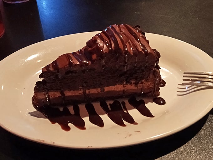 A chocolate cake so rich it should come with its own tax bracket &ndash; that glossy ganache topping is practically hypnotic.