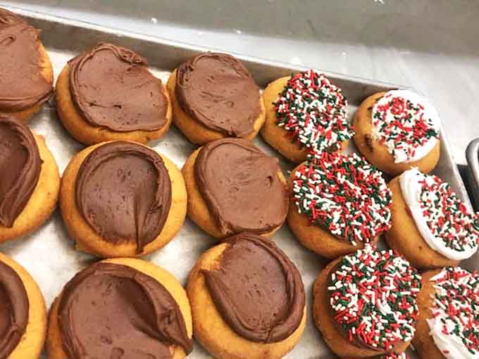 Holiday sprinkles bring festive flair to these classic cake donuts, while chocolate frosted varieties provide year-round comfort.