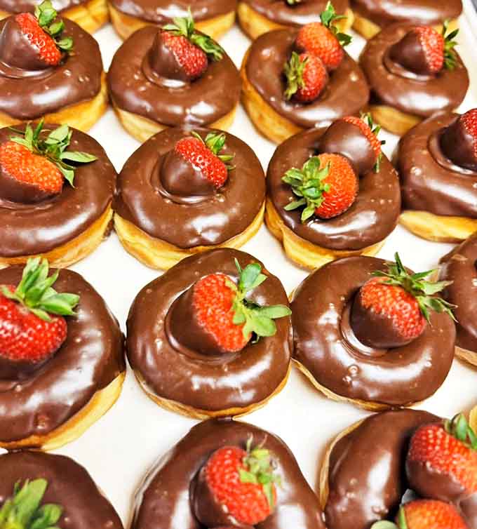 Chocolate Strawberry Donut: Chocolate-glazed donuts crowned with fresh strawberries &ndash; nature's way of saying "this counts as fruit."