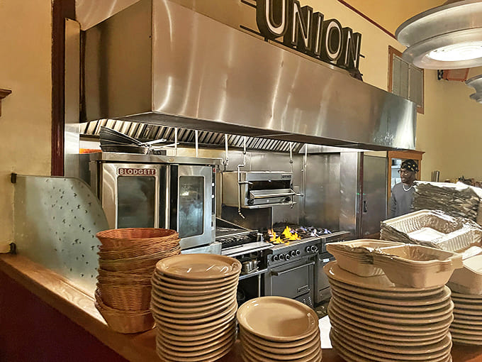 Behind the scenes, the kitchen team works their culinary magic, turning out plate after plate of soul-satisfying comfort food.