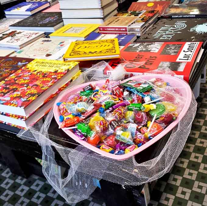 The heart-shaped candy basket near the register offers sweet rewards for literary adventurers &ndash; nourishment for both mind and body.