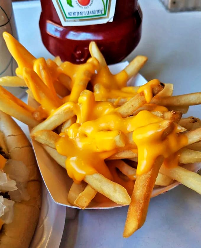 Cheese fries that defy gravity &ndash; golden potatoes bathed in a velvety cheese sauce that clings lovingly to each fry instead of pooling at the bottom. Pure indulgence!