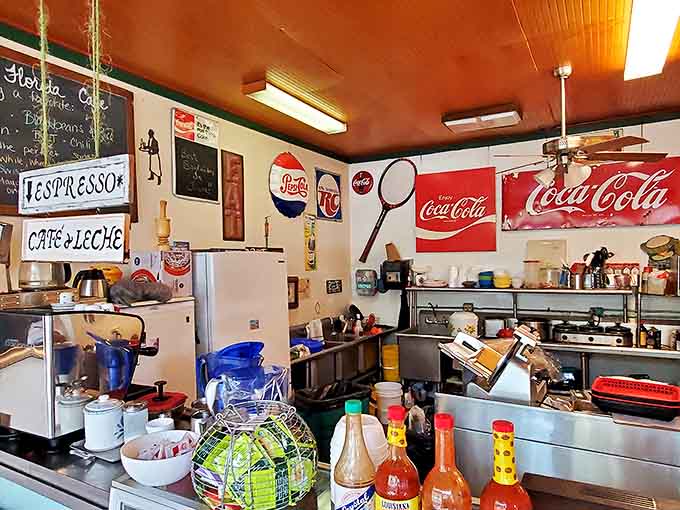The counter area showcases vintage signs and collectibles that could keep antique lovers entertained for hours between bites.