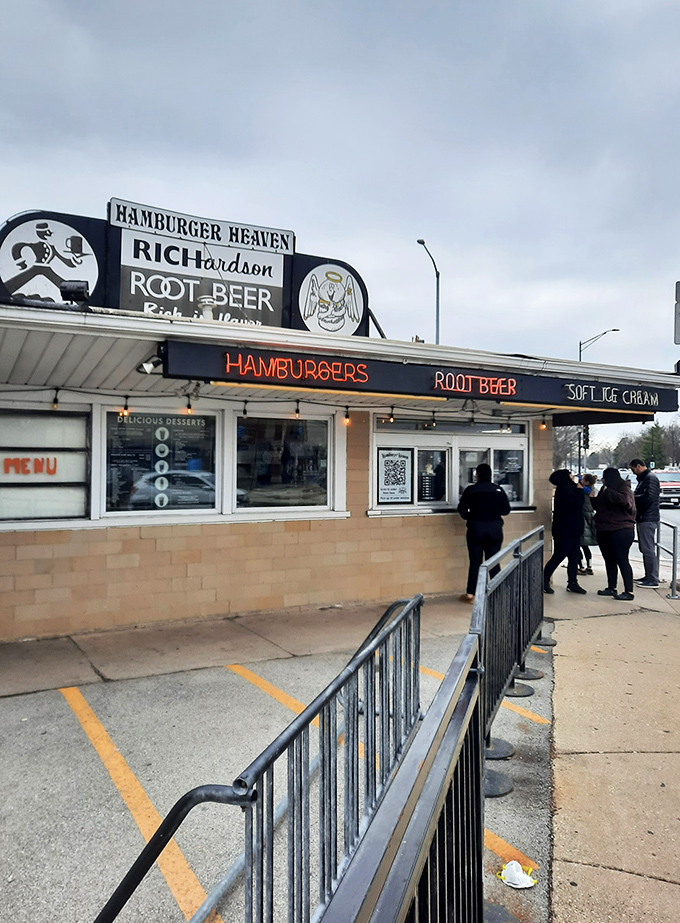 Customers: Patient patrons line up for their turn at burger nirvana &ndash; a testament to food worth waiting for, no matter the weather.
