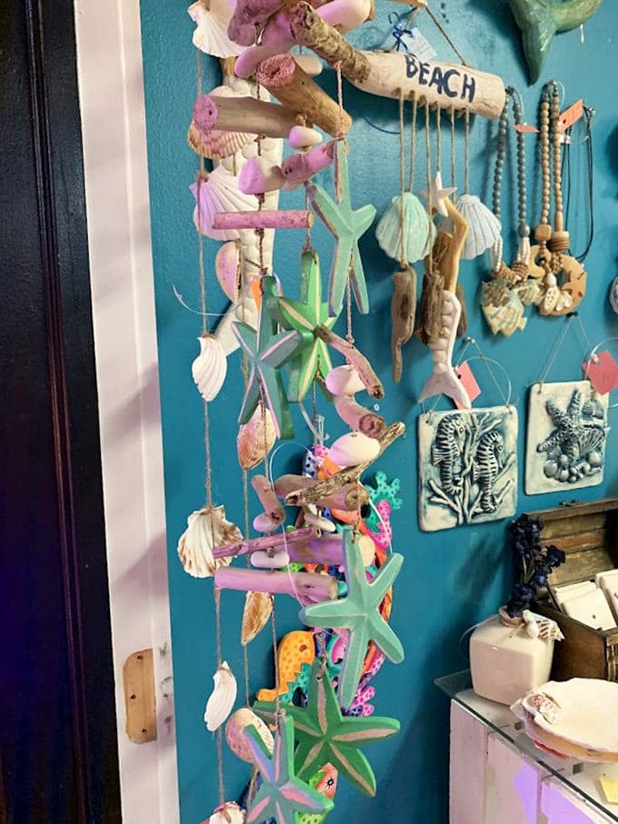 Beach-themed treasures dangle like memories of summer &ndash; handcrafted from shells, driftwood and sea glass that capture Florida's coastal magic.