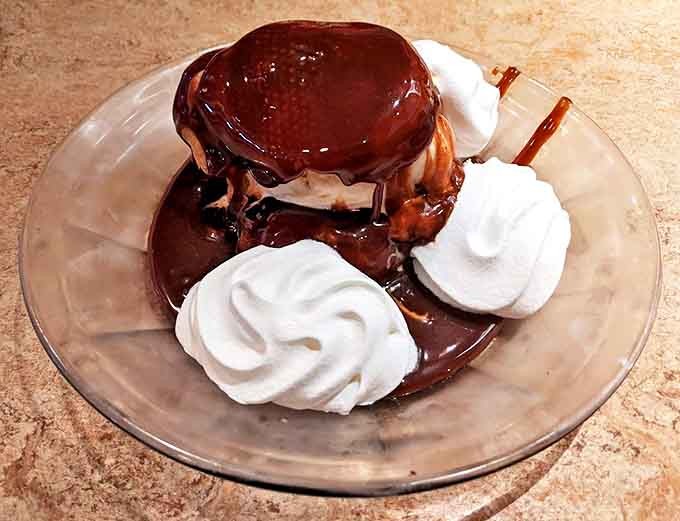 Dessert nirvana: A hot fudge cream puff sundae that makes you question why you saved room, yet grateful that you somehow managed to.