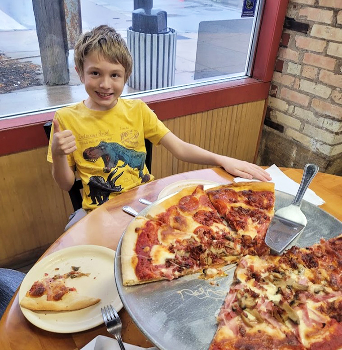 Where pizza memories are made: families gathering around tables to participate in the time-honored tradition of debating who gets the last slice.