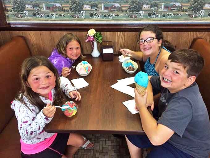Families creating sweet memories at Sherman's, where ice cream brings together multiple generations in a shared moment of joy.